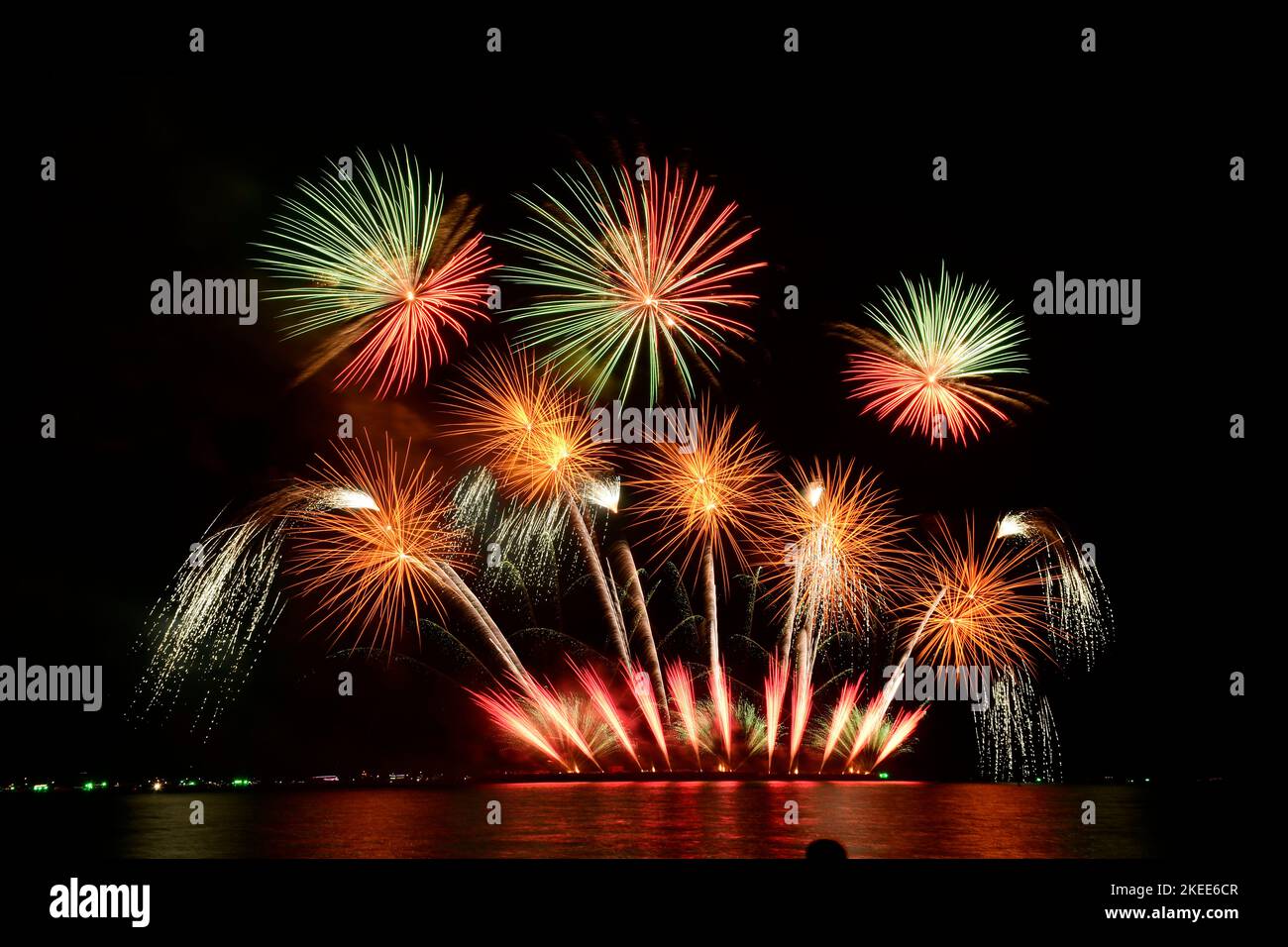 Firework celebration from the sea shore. Colorful fireworks celebration ...