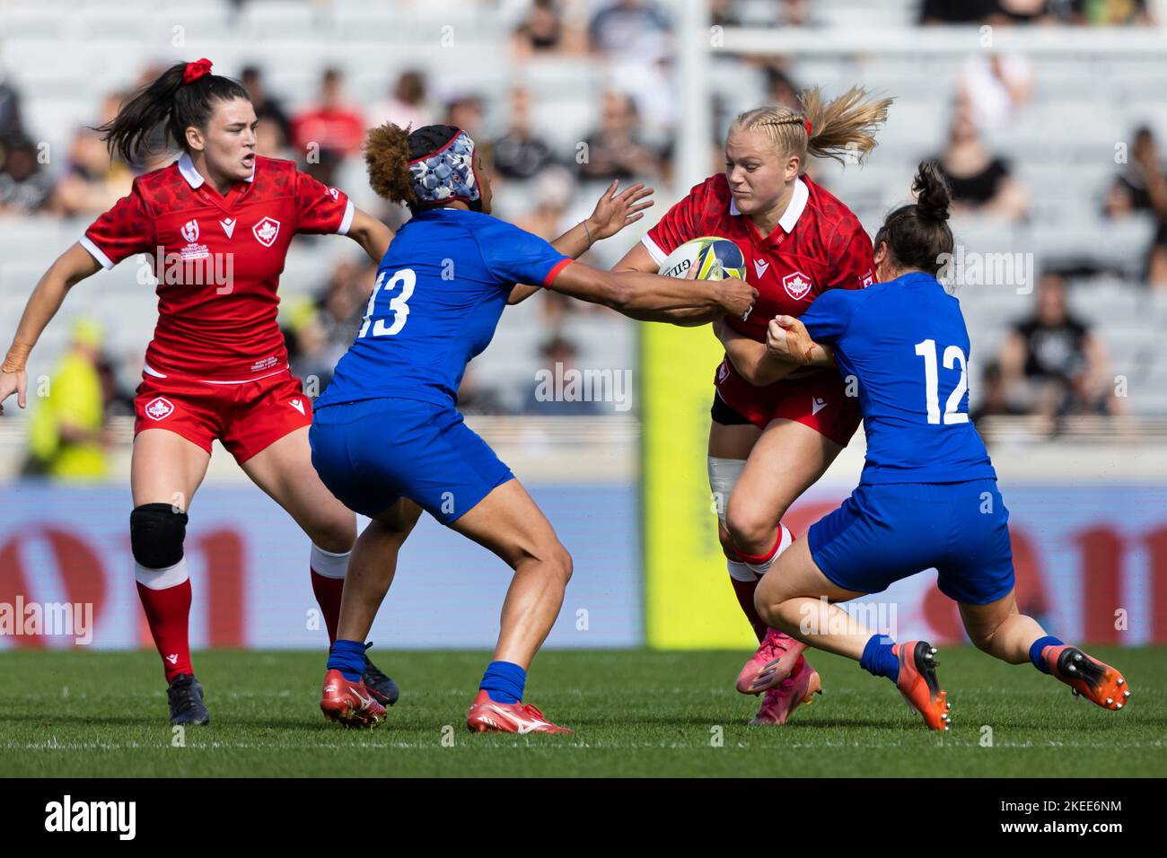 Canada's Sara Kaljuvee is tackled by Maelle Filopon (left) and ...