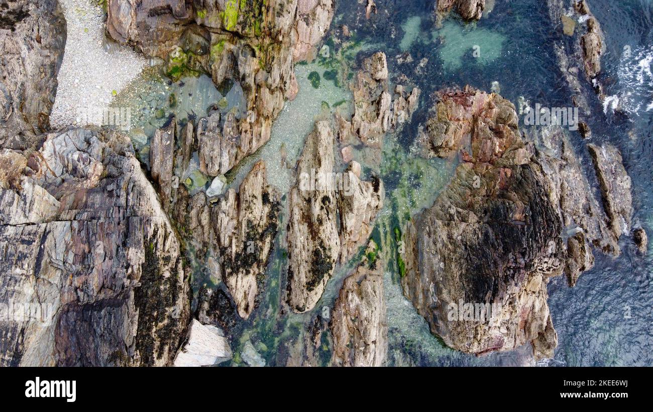 Drone point of view. View from above. A lot of boulders in the sea ...