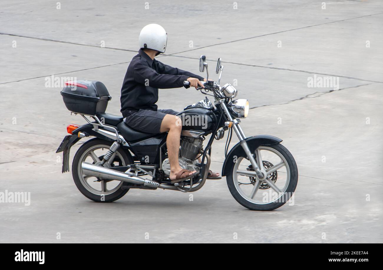 A man rides a classic touring motorcycle Stock Photo - Alamy