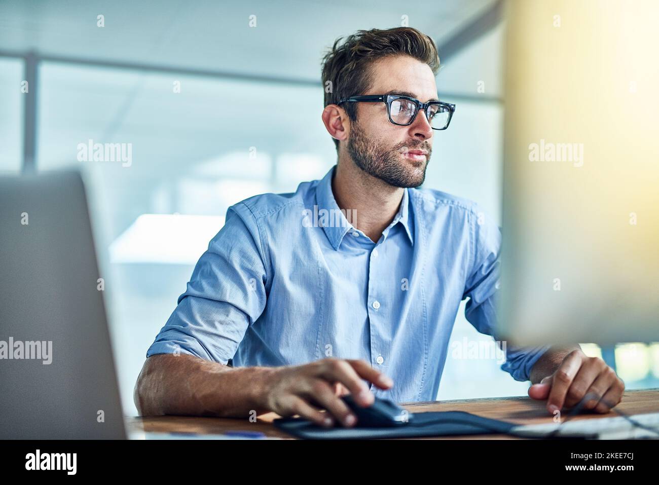 Man in a formal suit working on a desk hi-res stock photography and ...
