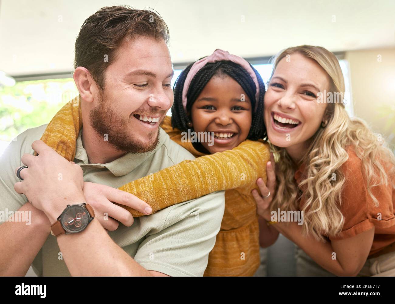 Family, children and adoption with a girl, mother and father bonding in ...