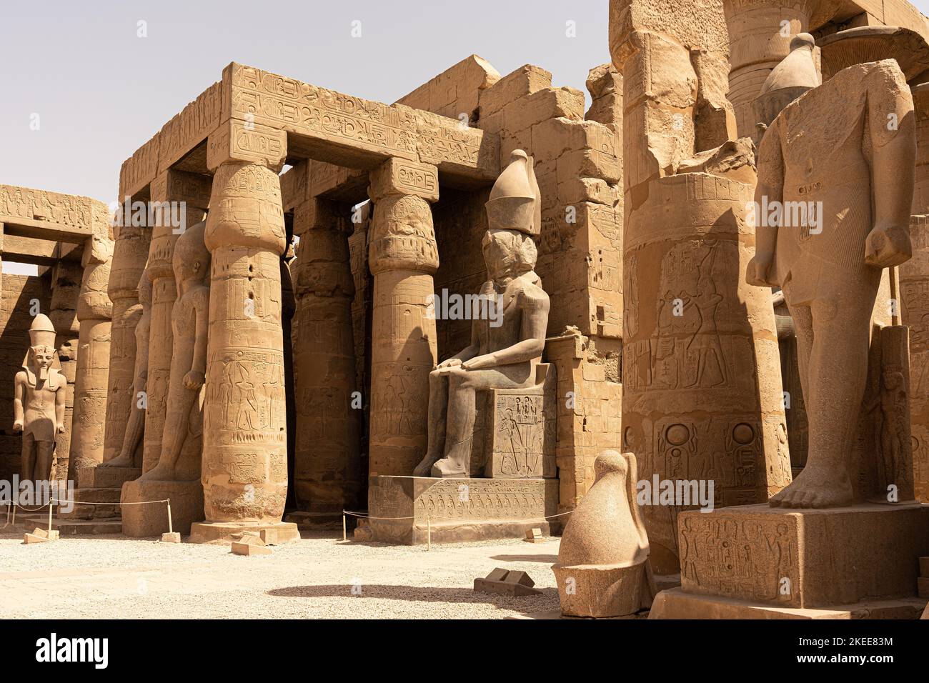 Columns and statues in an egyptian temple Stock Photo - Alamy