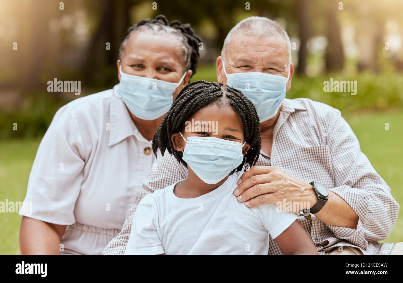Family portrait, covid and face mask outdoor at nature park with child ...