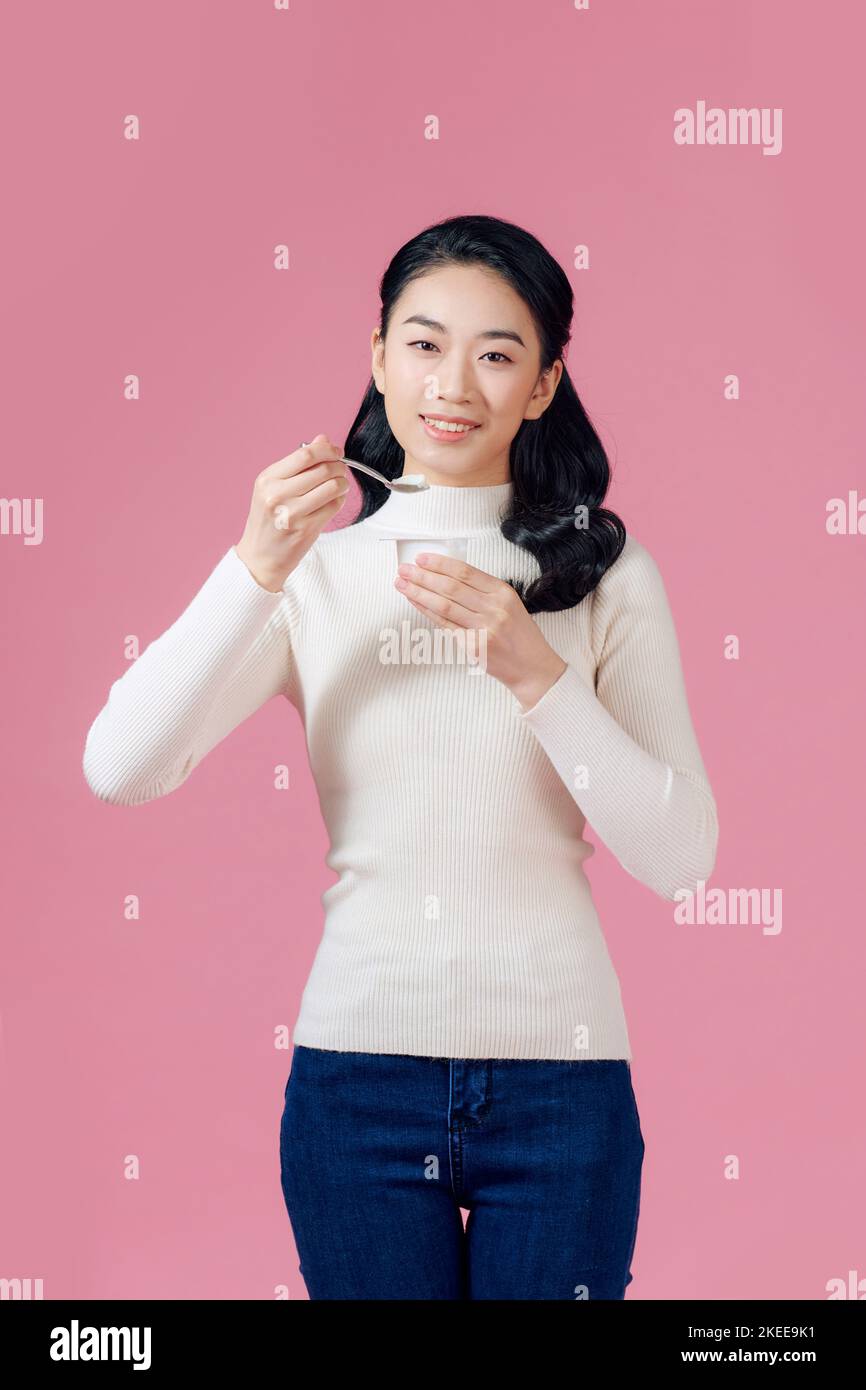 Woman yogurt smiling hi-res stock photography and images - Alamy