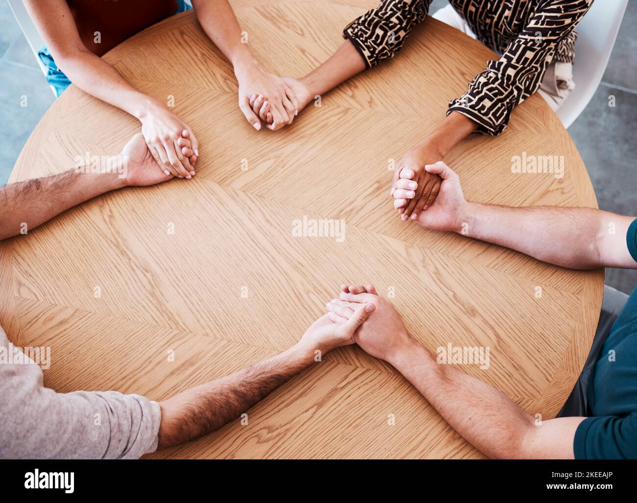 Business people holding hands in therapy group, team building or staff ...