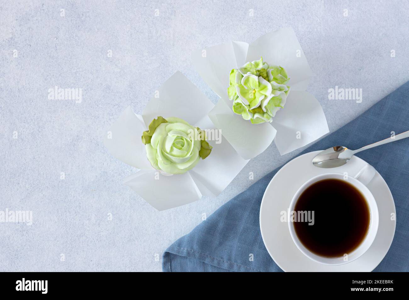 tea set in a composition with marshmallow flowers. Coffee mug on a ...