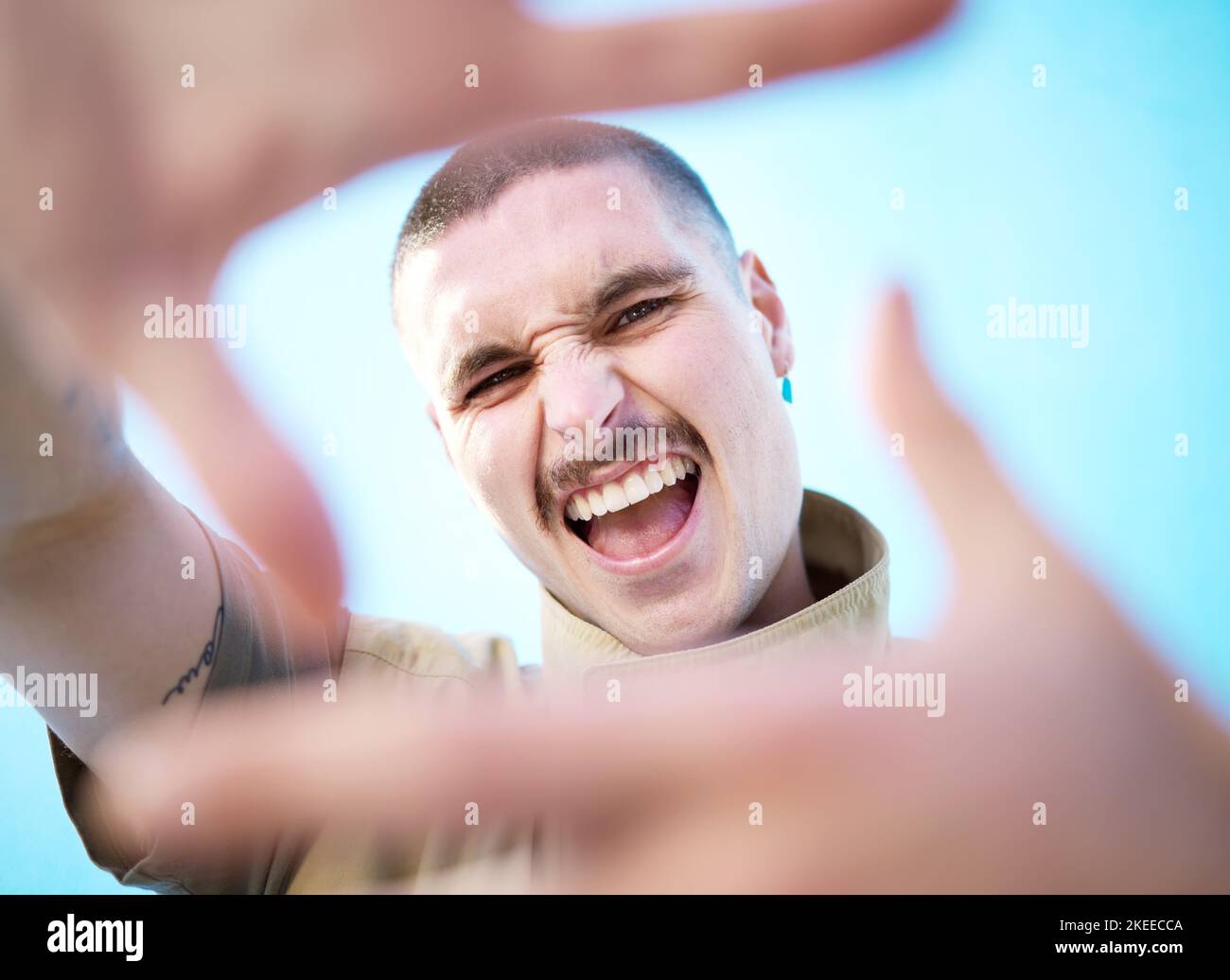 Face hands frame, smile and man portrait feeling happy about beauty ...