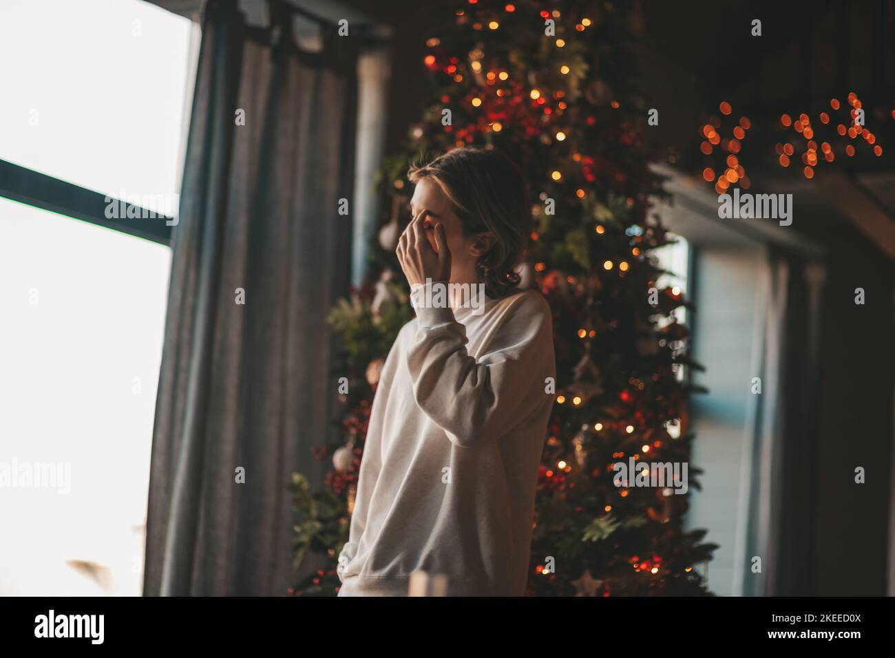 Young teen boy with long hair thoughtful look sad eyes negative mood ...