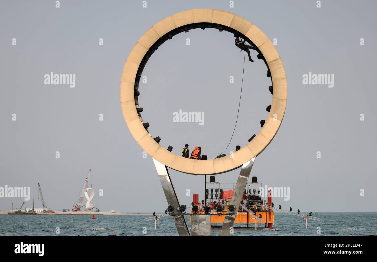 Doha, Qatar. 9th Nov, 2022. Workers work near the Doha Corniche in Doha ...