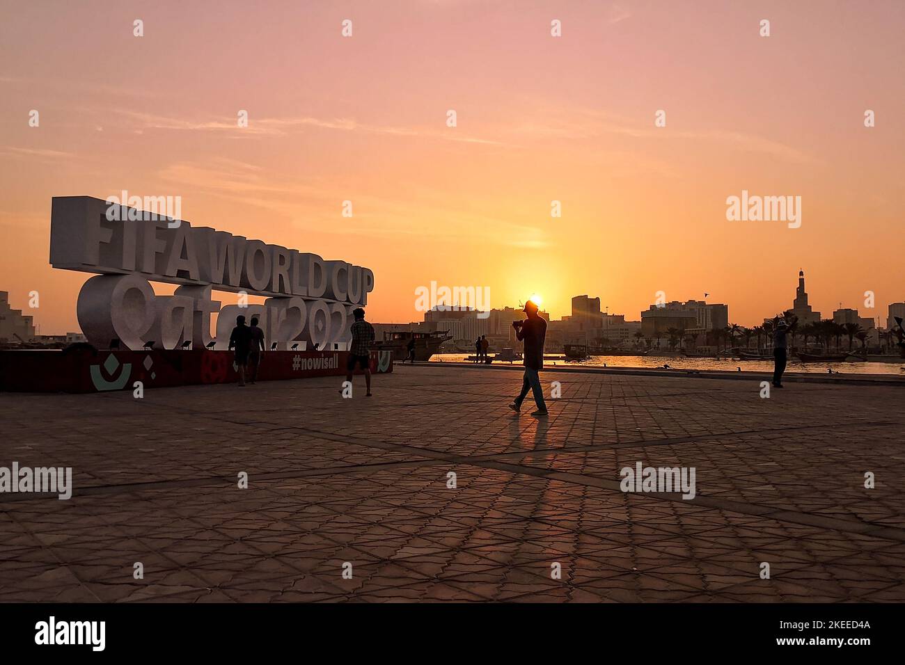 Doha, Qatar. 11th Nov, 2022. People take photos with the FIFA World Cup ...