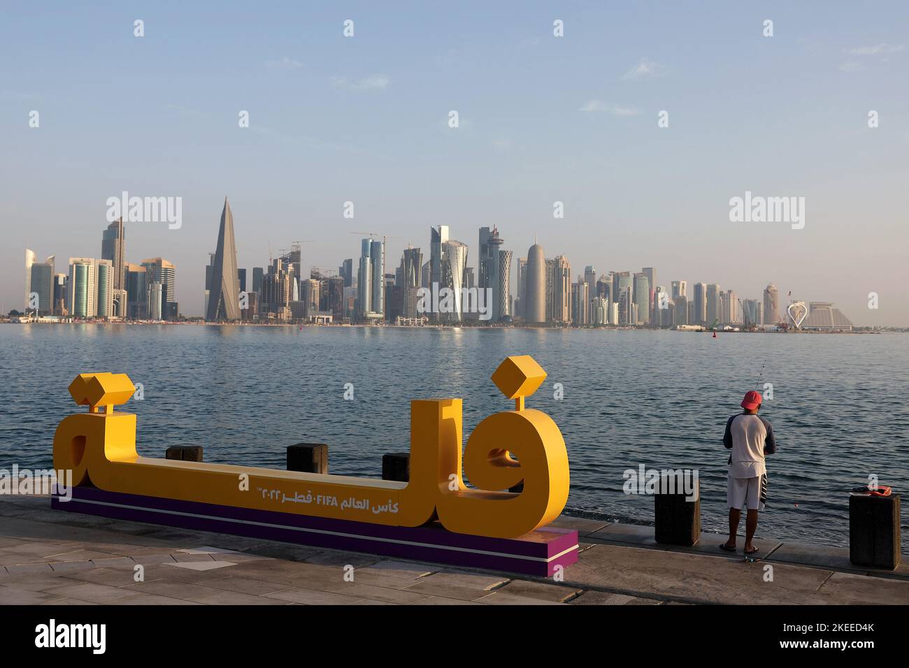Doha, Qatar. 11th Nov, 2022. A man fishes at the Doha Corniche in Doha ...