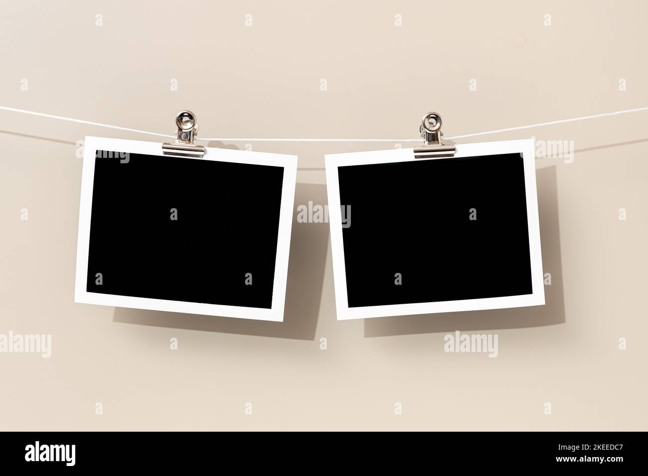 Two Blank Vintage instant photo frame hanging on a rope. Template Stock ...