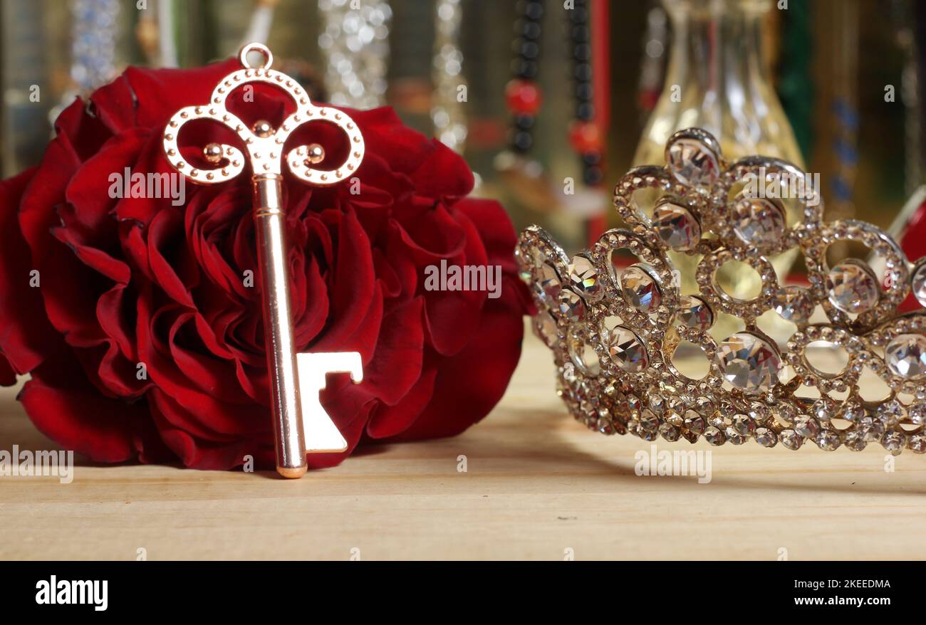Red Rose with Key and Tiara on Dressing Table Stock Photo - Alamy
