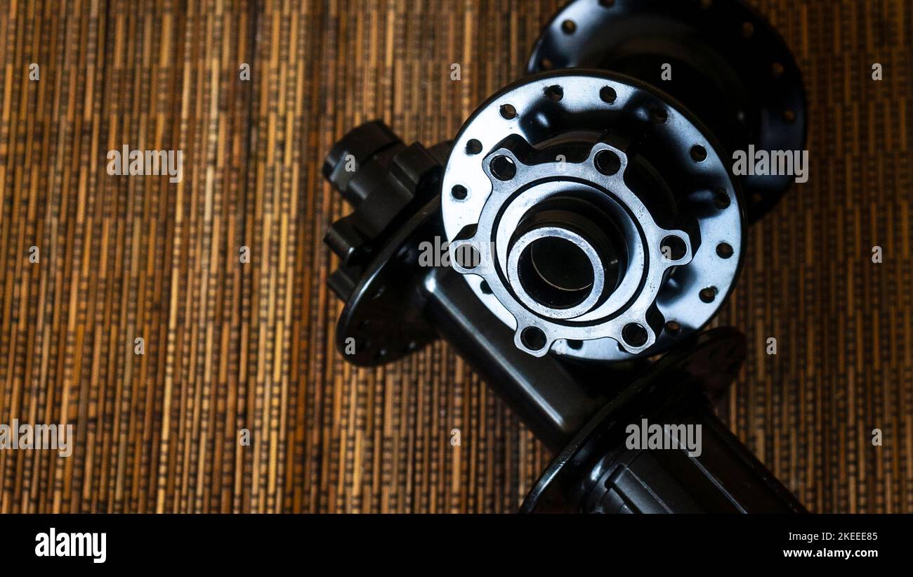 Bicycle front hub and rear hub on wooden background Stock Photo - Alamy