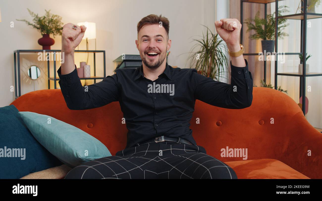 Happy caucasian man shouting, celebrating success, winning, goal ...