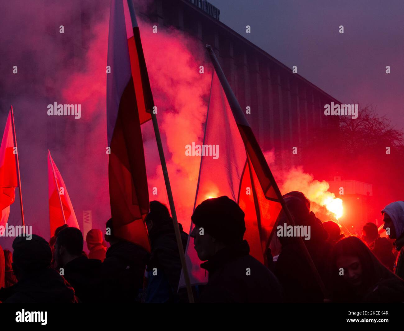 People holding flares and flags during the Independence day. Poland ...