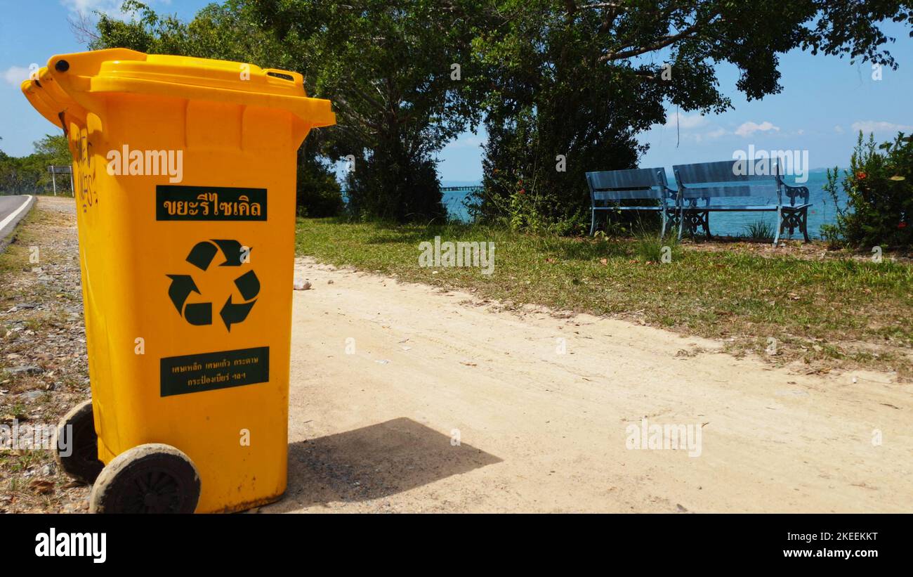 Plastic bin yellow for Garbage Waste at asphalt road in asian tropical ...