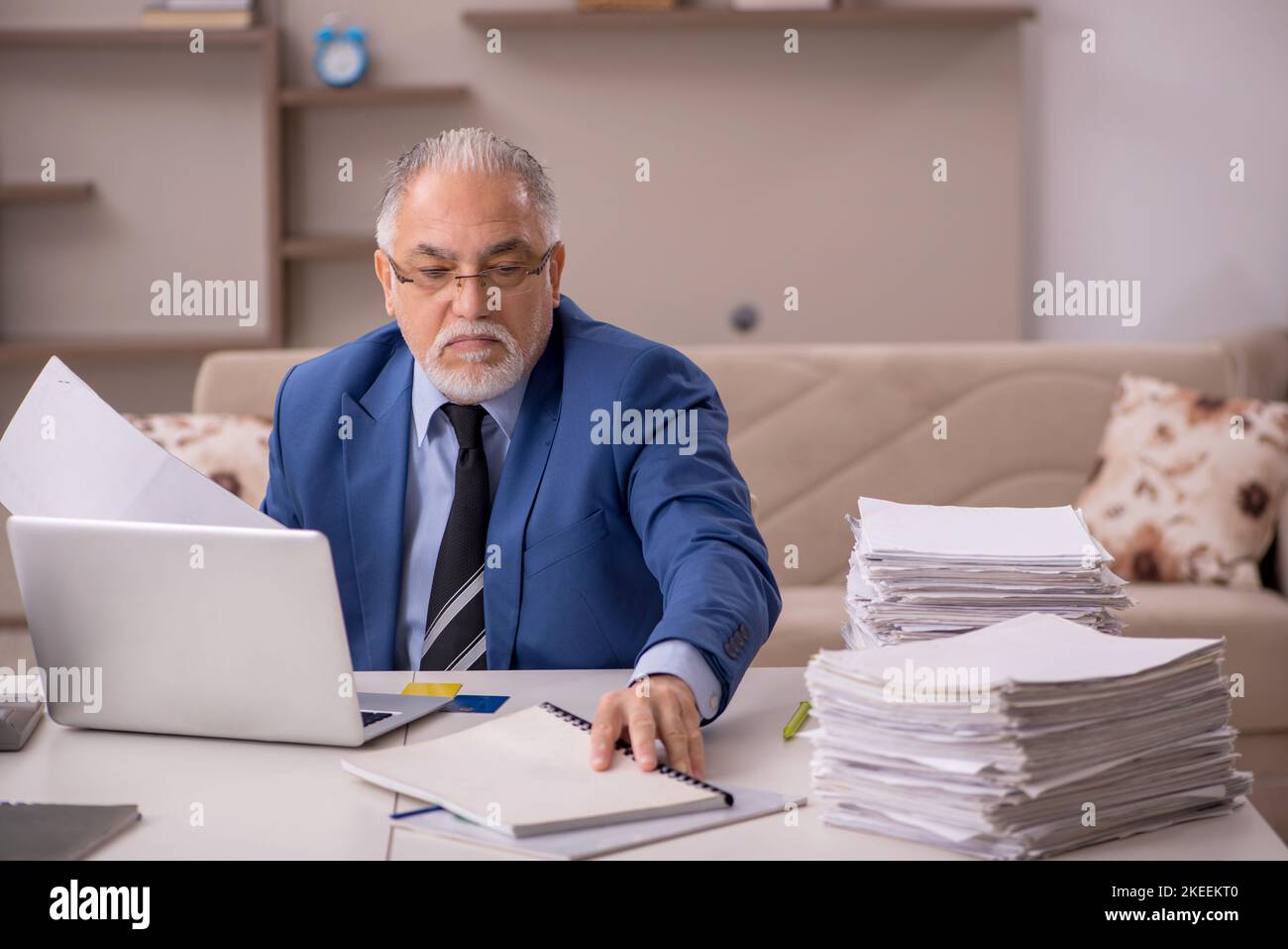 Old boss working from home during pandemic Stock Photo - Alamy
