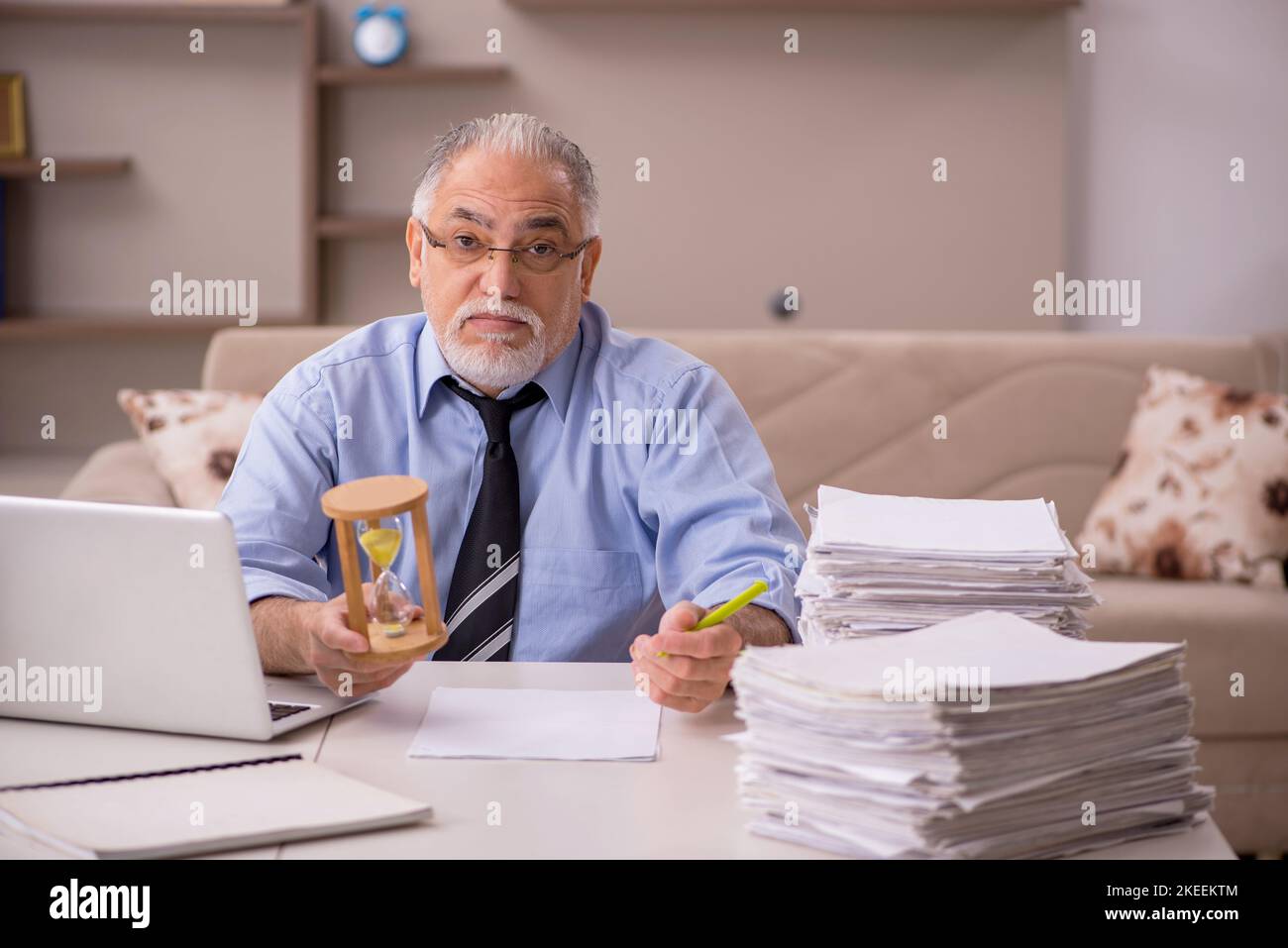 Old boss working from home during pandemic Stock Photo - Alamy
