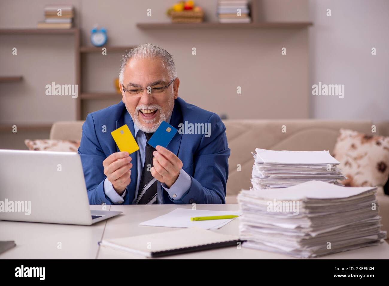 Old boss working from home during pandemic Stock Photo - Alamy