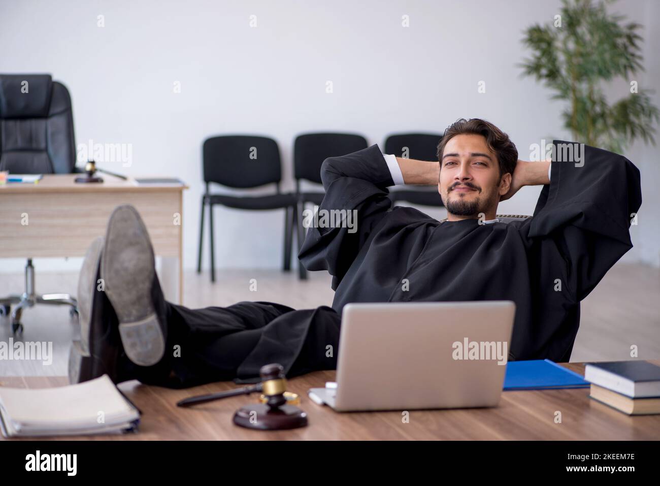Young judge working in the courthouse Stock Photo - Alamy
