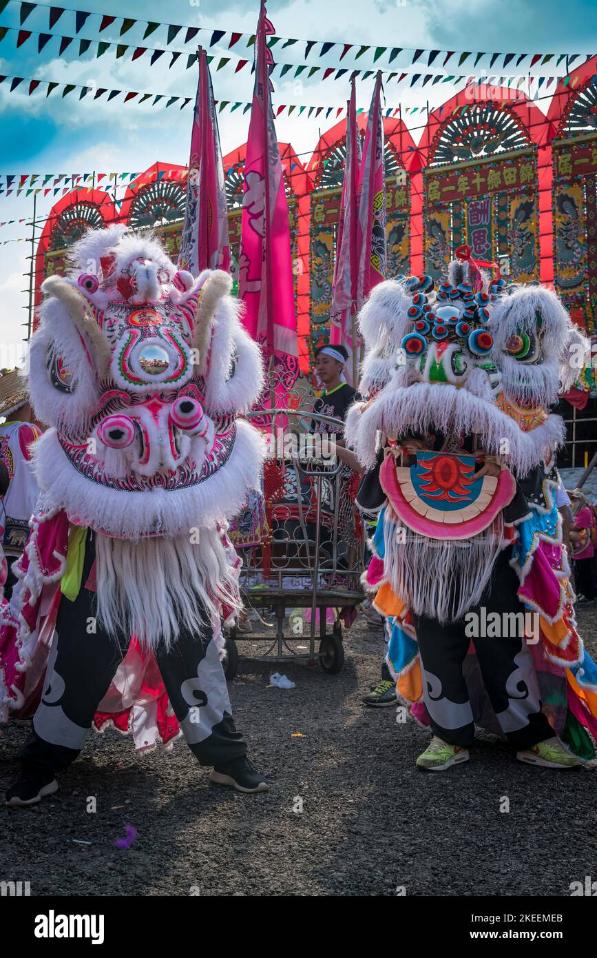 Lion dancers prepare their elaborate, colourful puppets for a ...