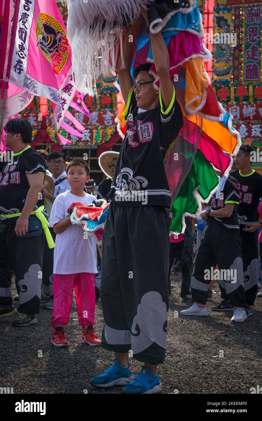 Lion dancers prepare their elaborate, colourful puppets for a ...