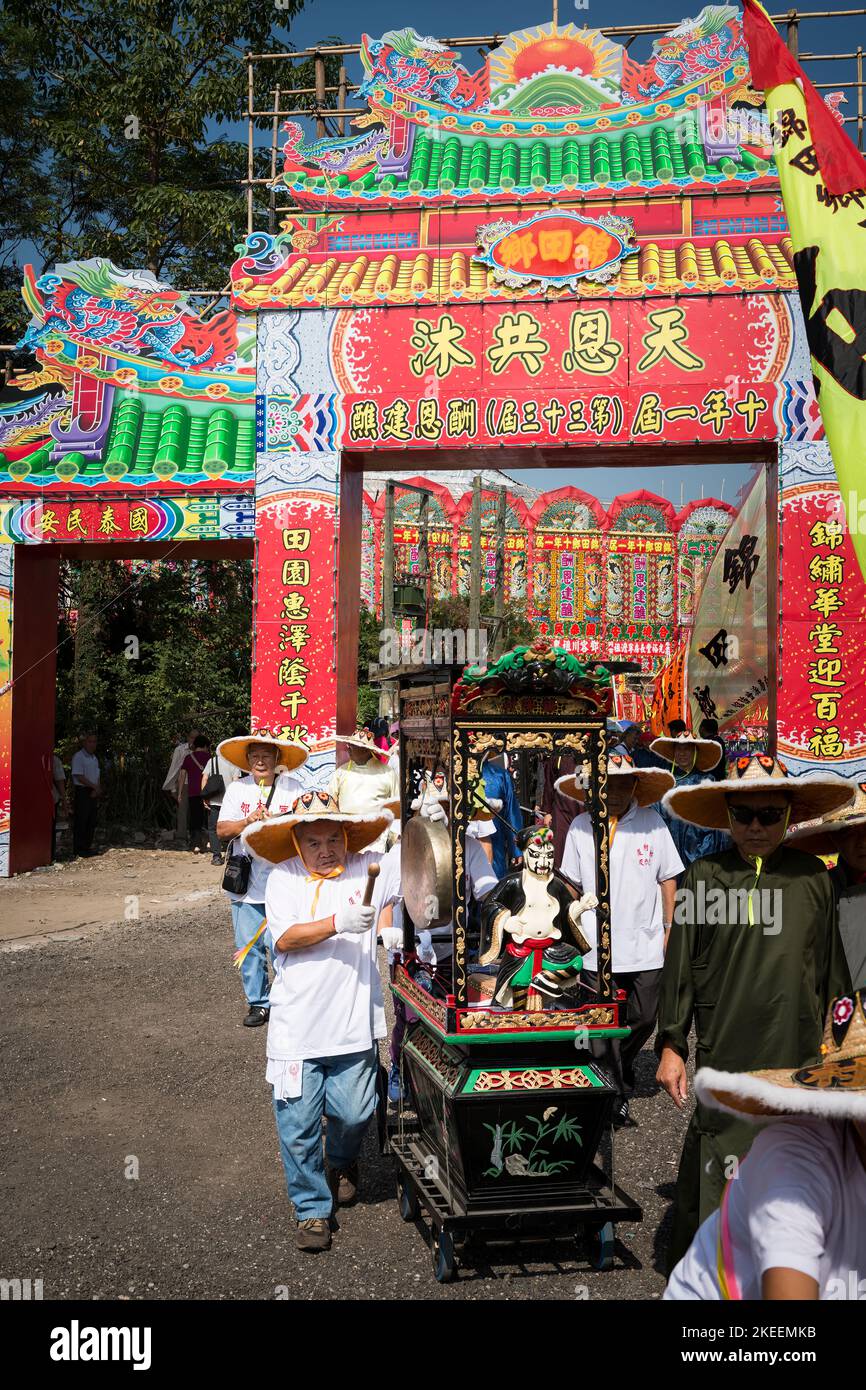 Villagers leave the decennial Da Jiu festival site for a procession ...