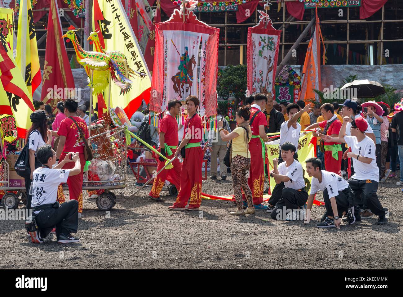 Lion dance teams pose for a group photograph as a dragon dance team ...