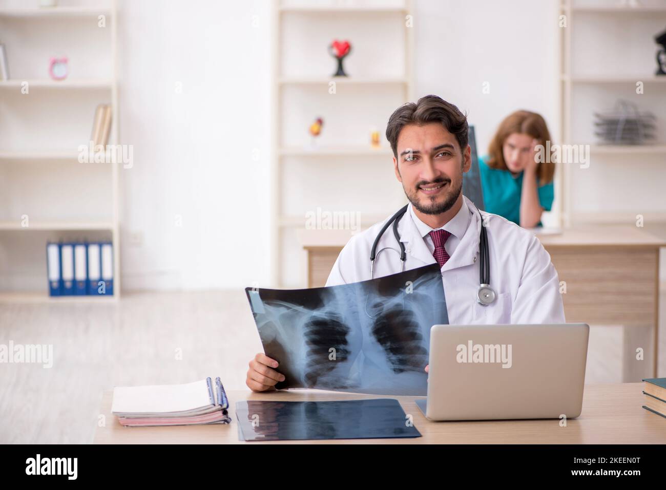 Young male doctor radiologist and female assistant working at the ...