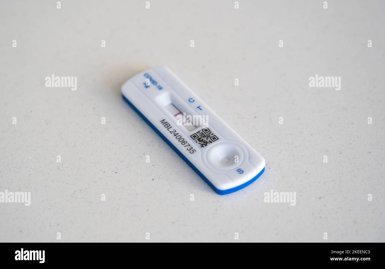 A positive Covid test. The lateral flow kit shows two lines indicating ...