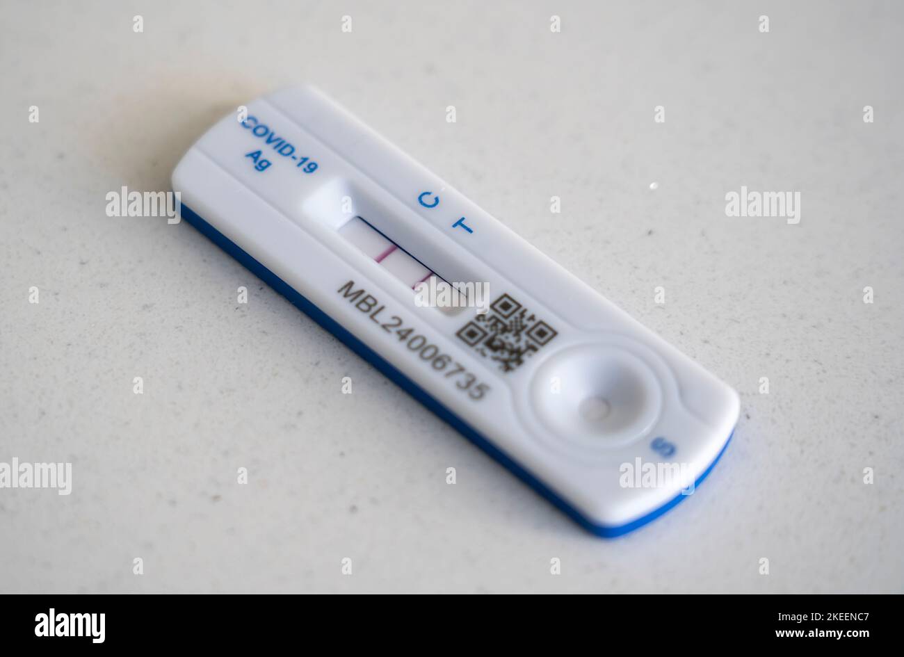 A positive Covid test. The lateral flow kit shows two lines indicating ...