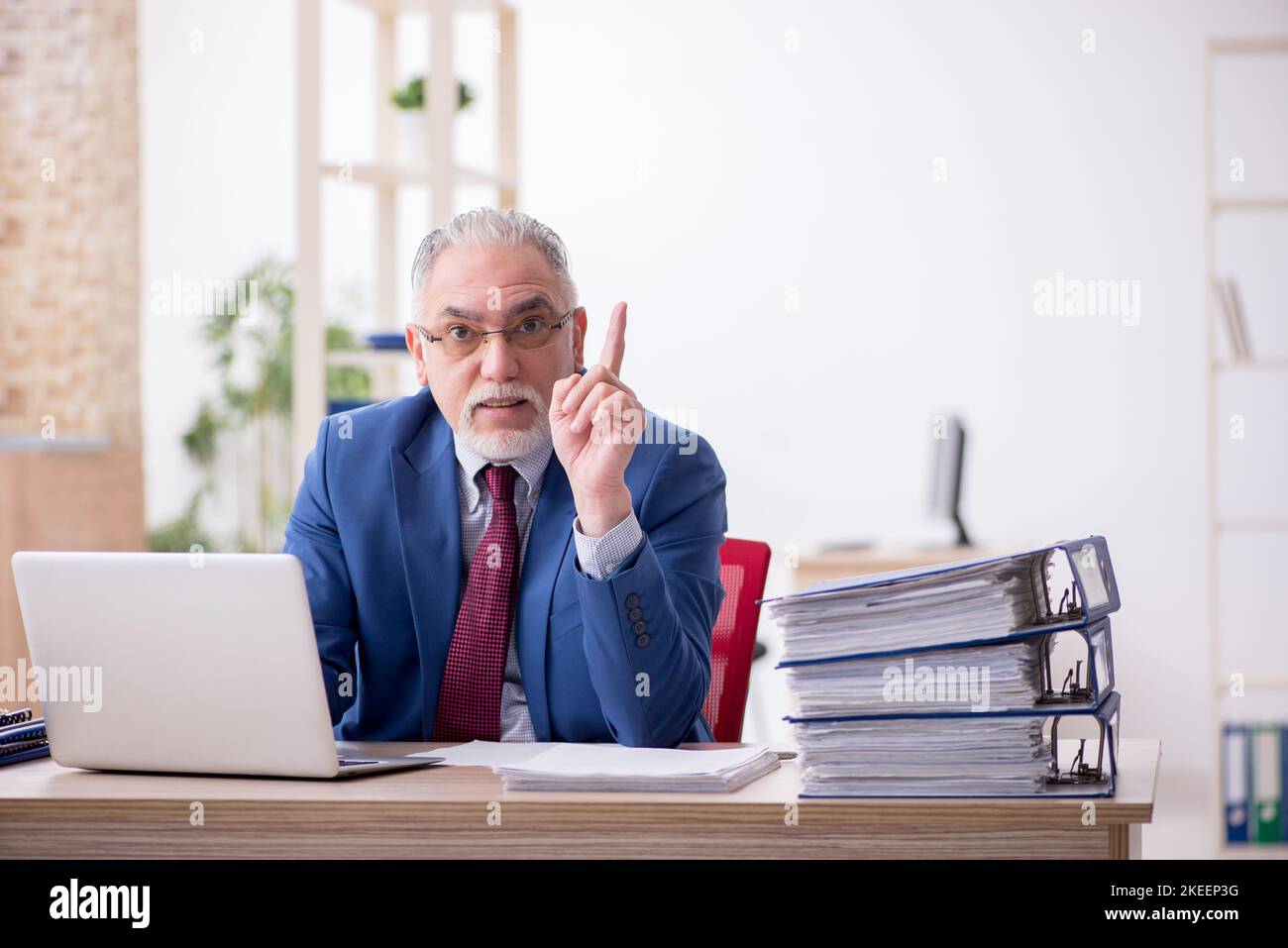 Old businessman employee and too much work in the office Stock Photo ...