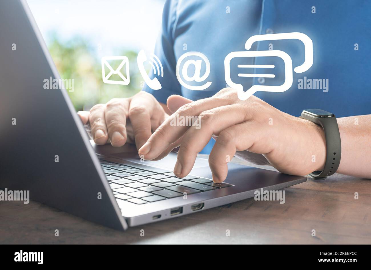 Contact us. businessman typing on laptop with mail, phone, email ...