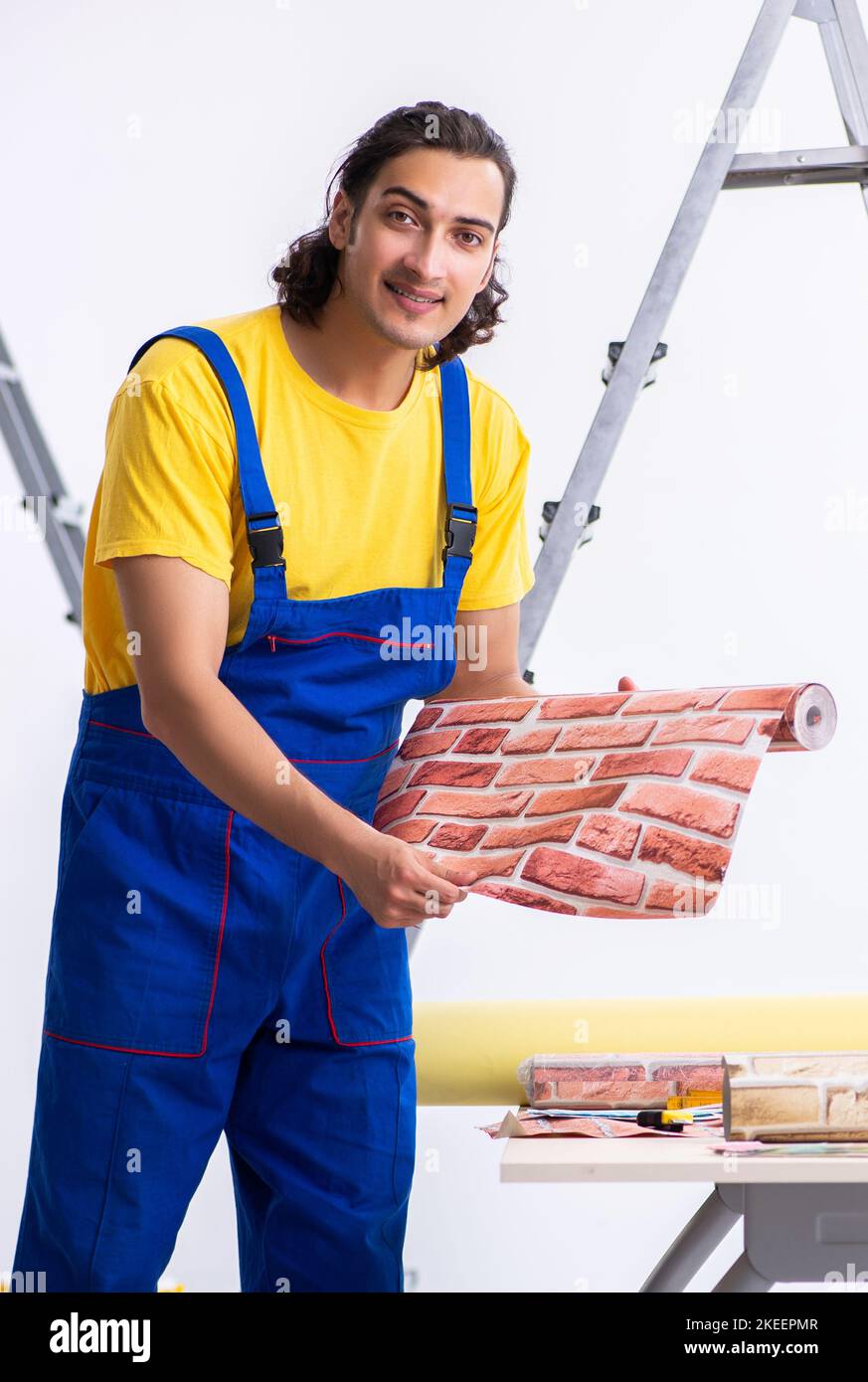 The young man contractor doing renovation at home Stock Photo - Alamy