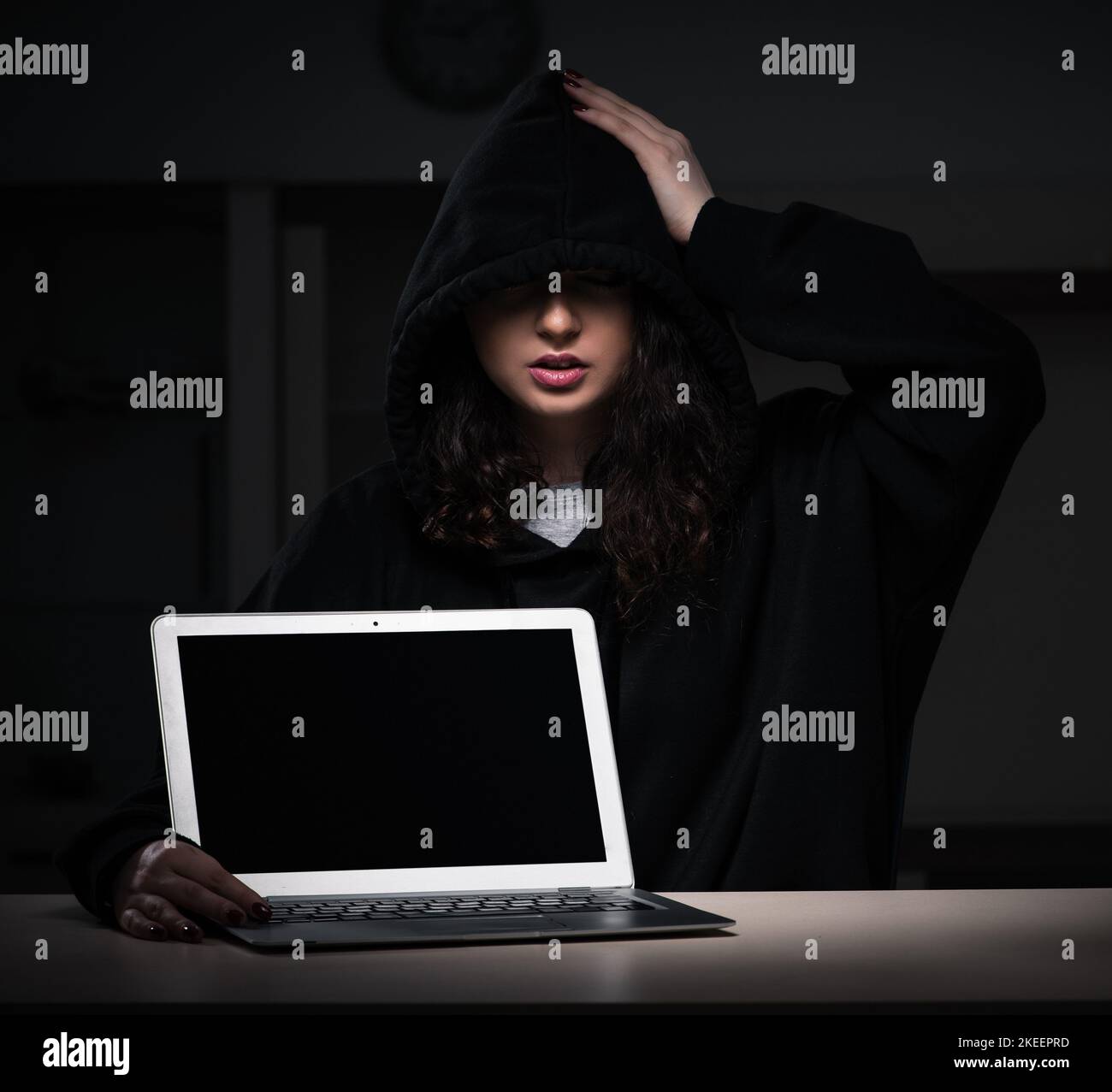 The female hacker hacking security firewall late in office Stock Photo ...