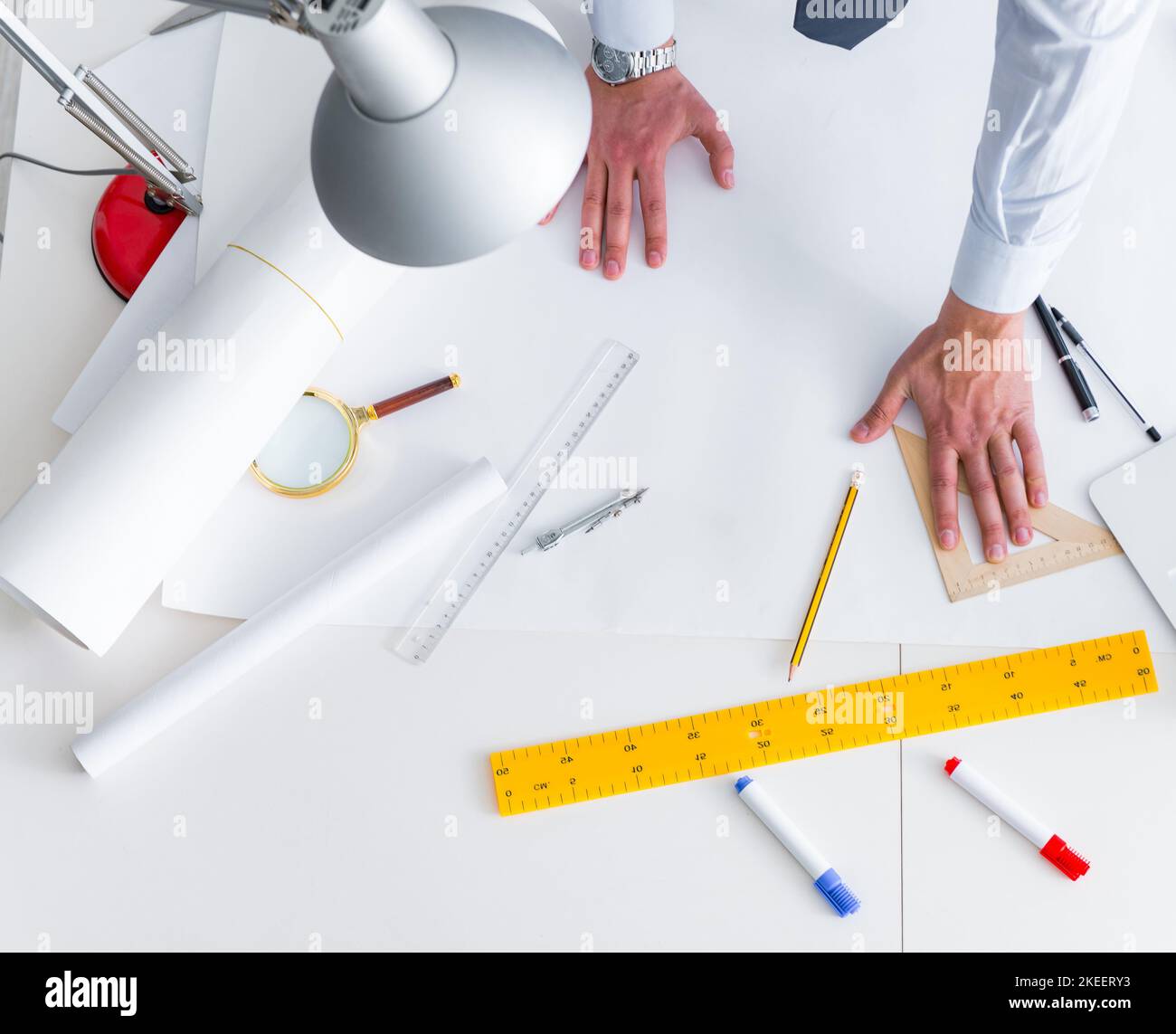The engineer working on new project drawings Stock Photo - Alamy