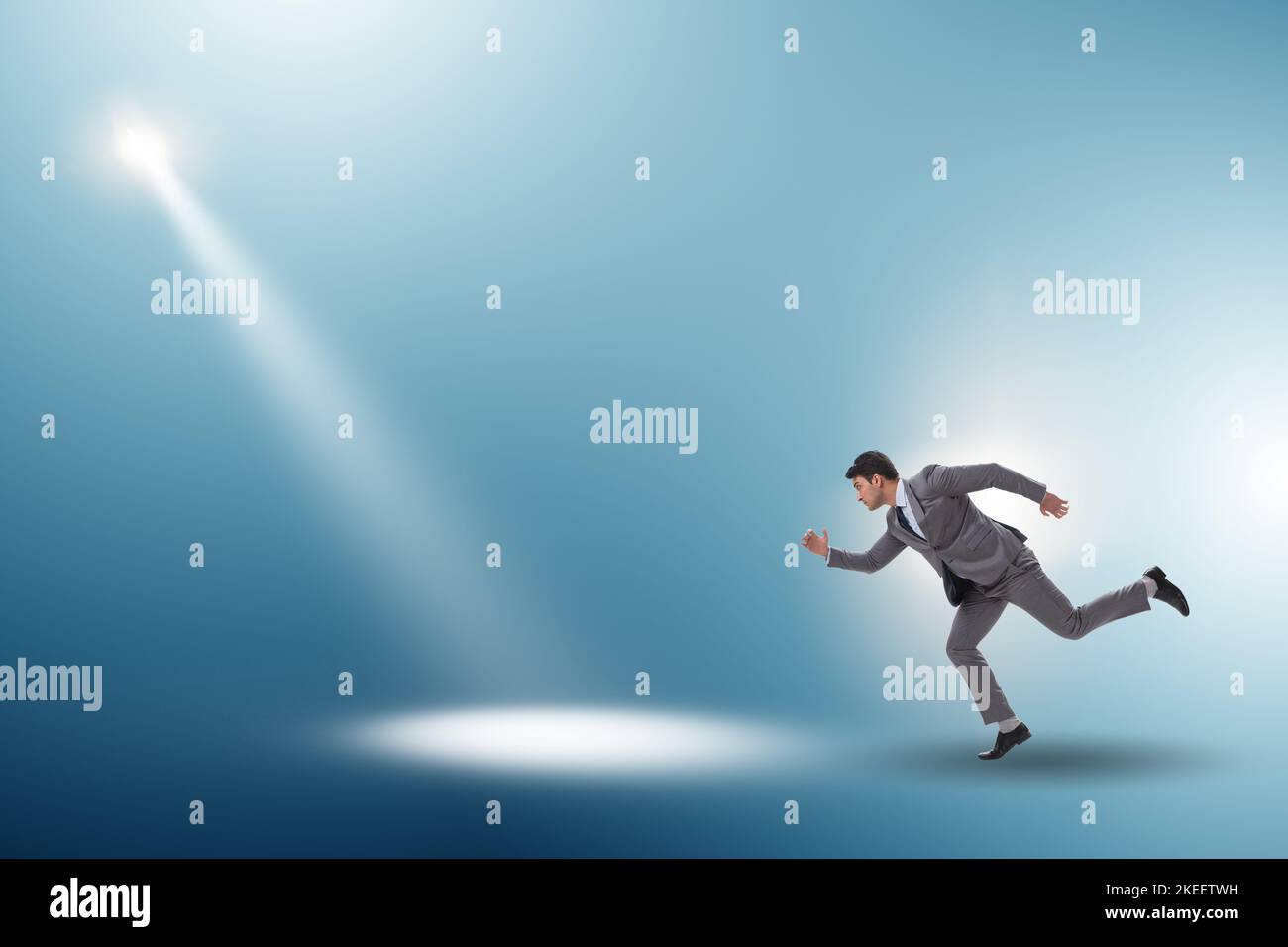 Business people under the spotlight concept Stock Photo - Alamy