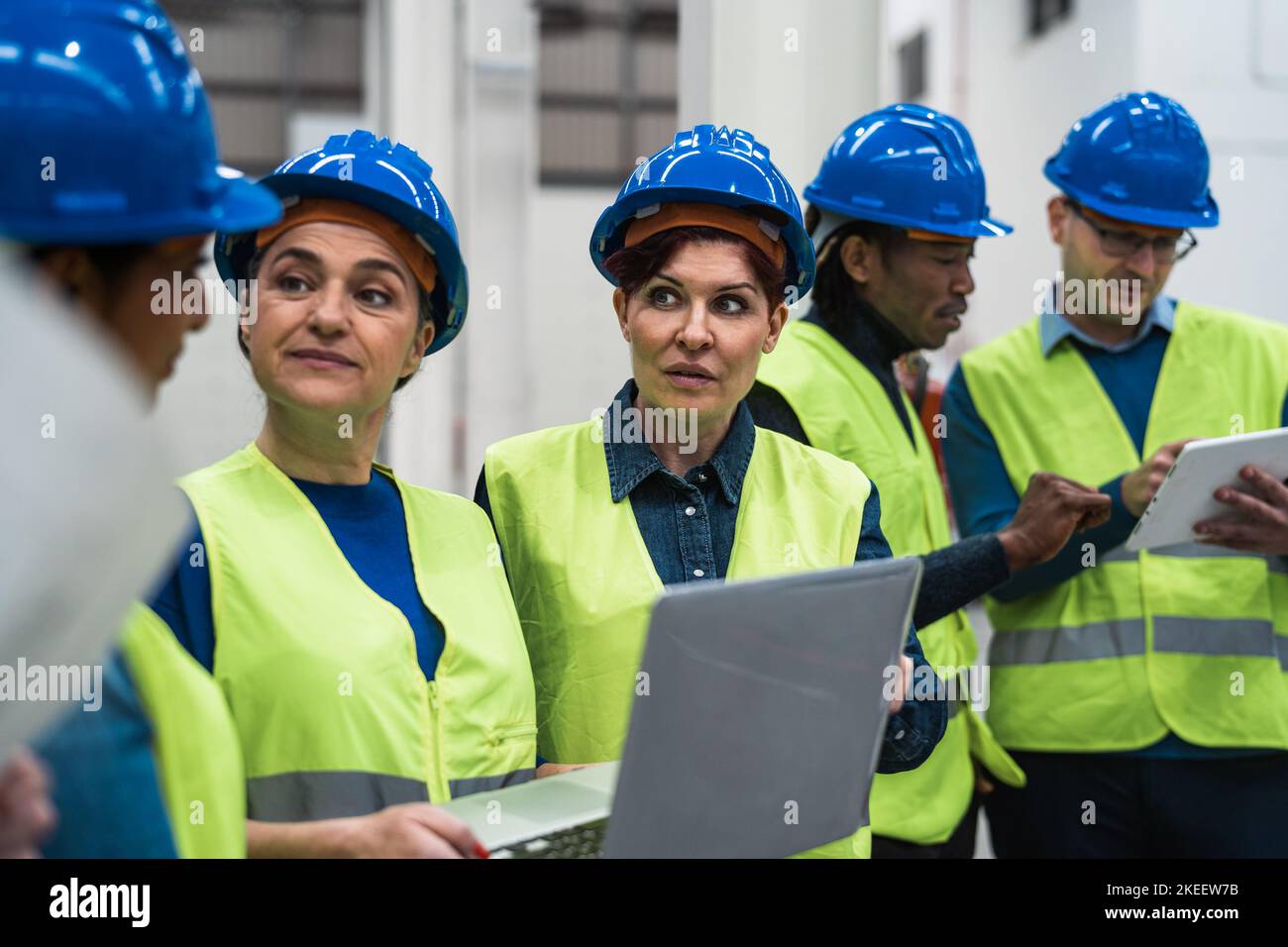 Team of diverse engineers working in robotic factory - Tech industrial concept Stock Photo - Alamy