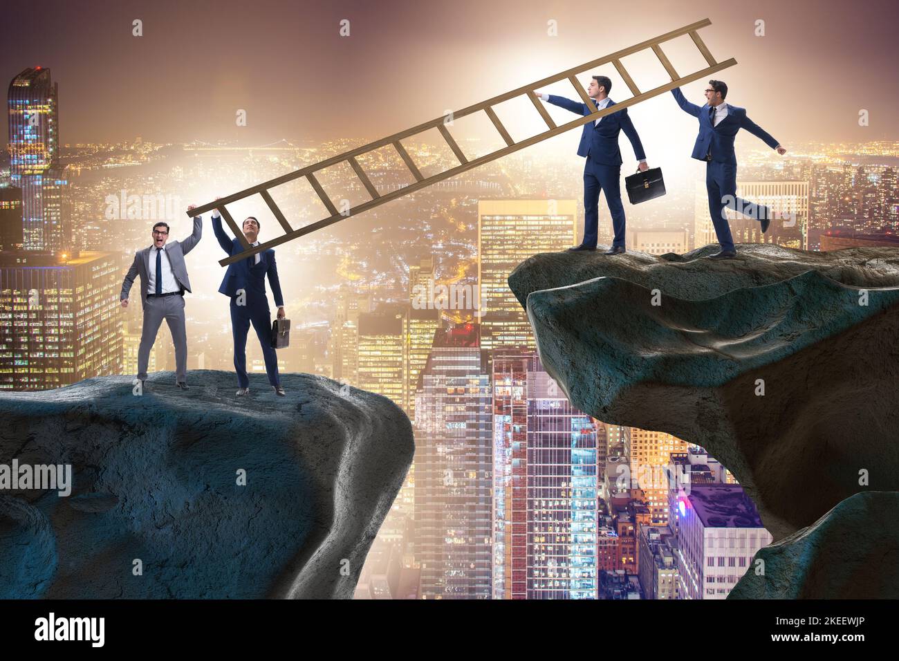 Business people helping to go over the chasm Stock Photo - Alamy