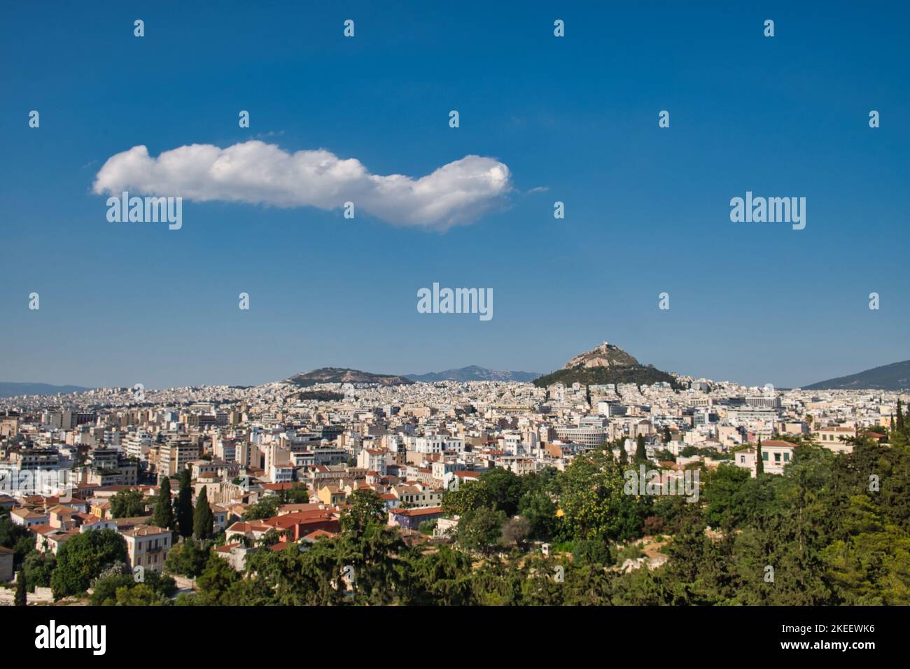 Panoramic view of Athens and the Lycabettus hill under a blue sky with ...
