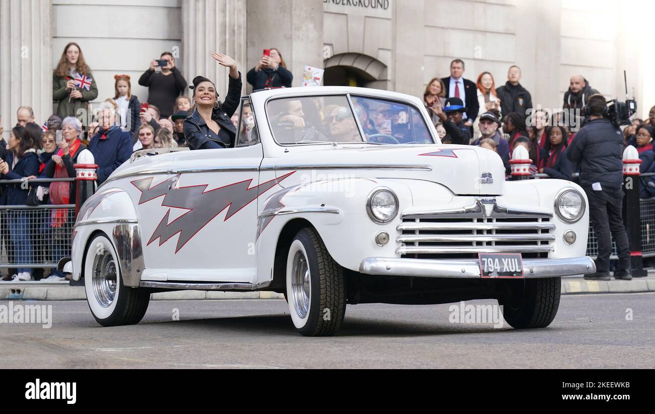Cast members from the musical Grease take part in the parade during the ...