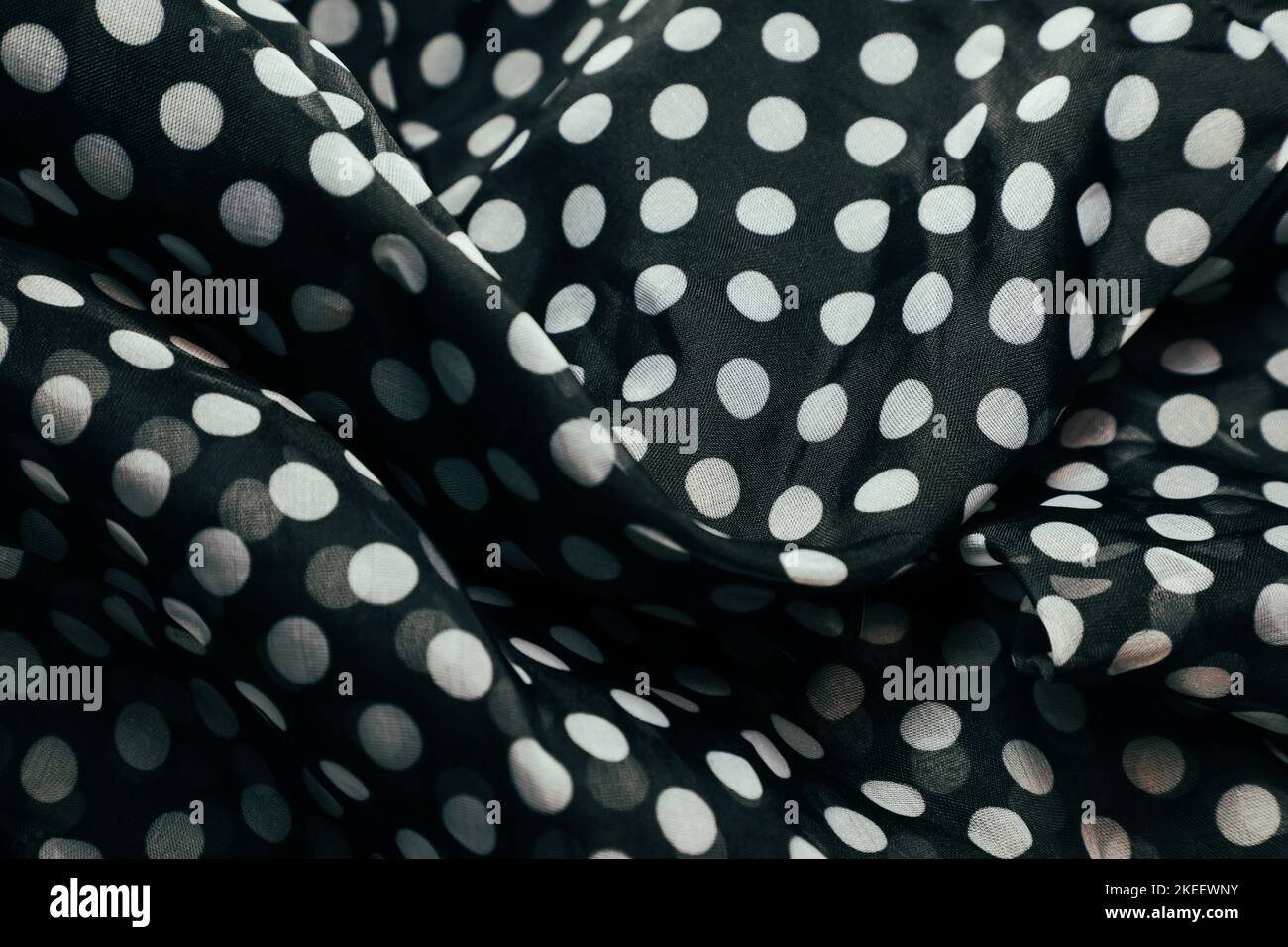 Gathered and folded texture of black and white color polka dot printed ...