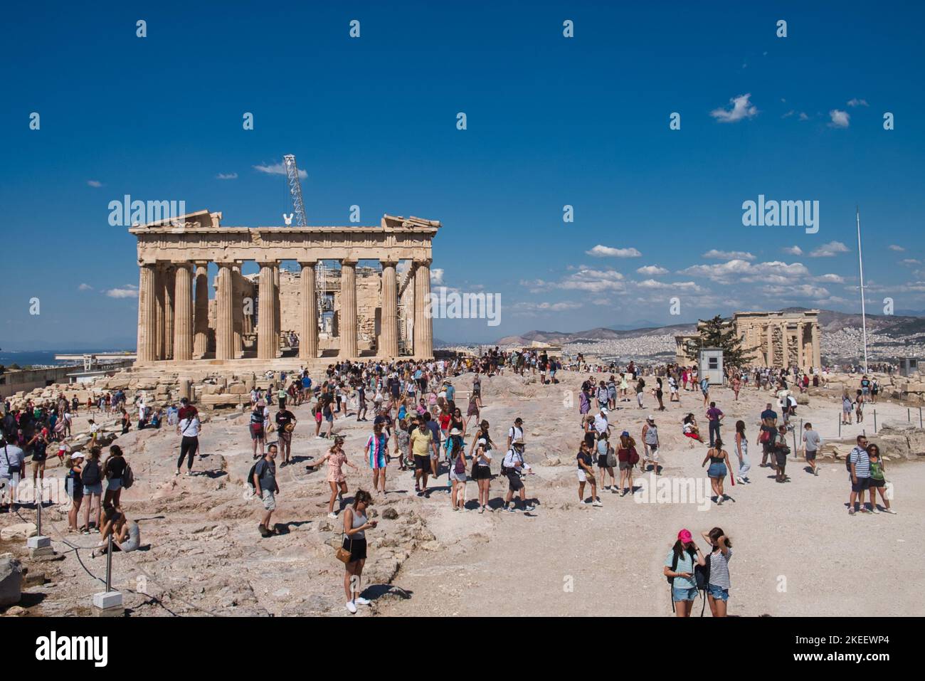 View of the top of the Acropolis with the Parthenon and tourists in ...