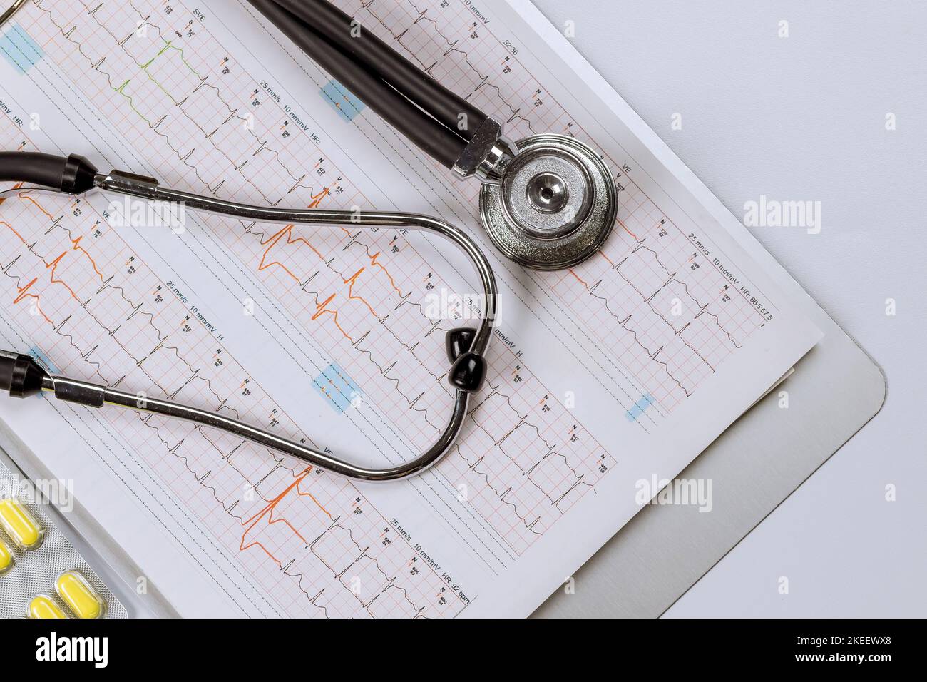 Office cardiovascular doctor with stethoscopes, heart cardiograms, and ...