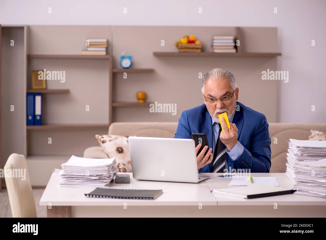 Old boss working from home during pandemic Stock Photo - Alamy