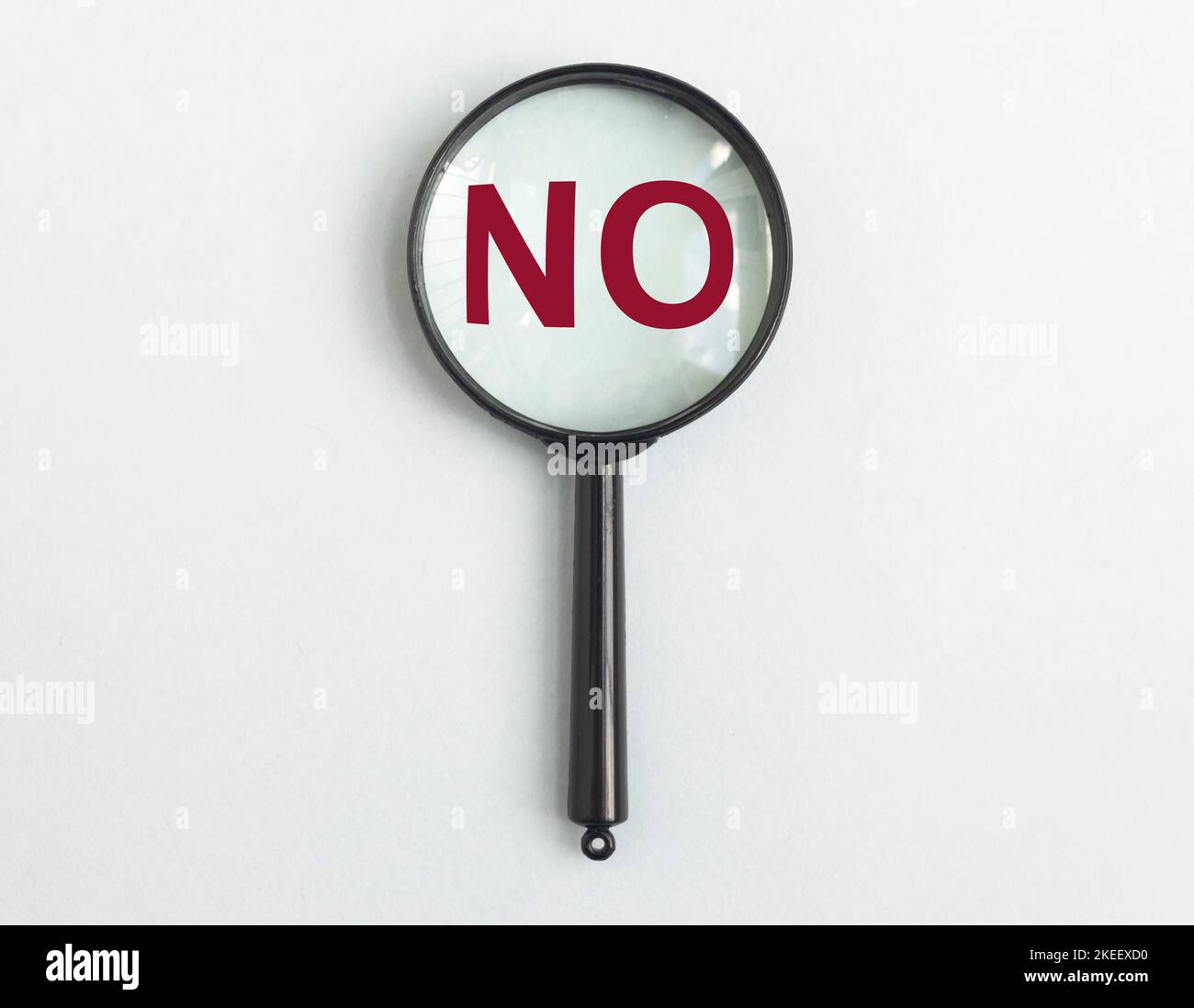 NO word through magnifying glass on light blue gray background Stock ...
