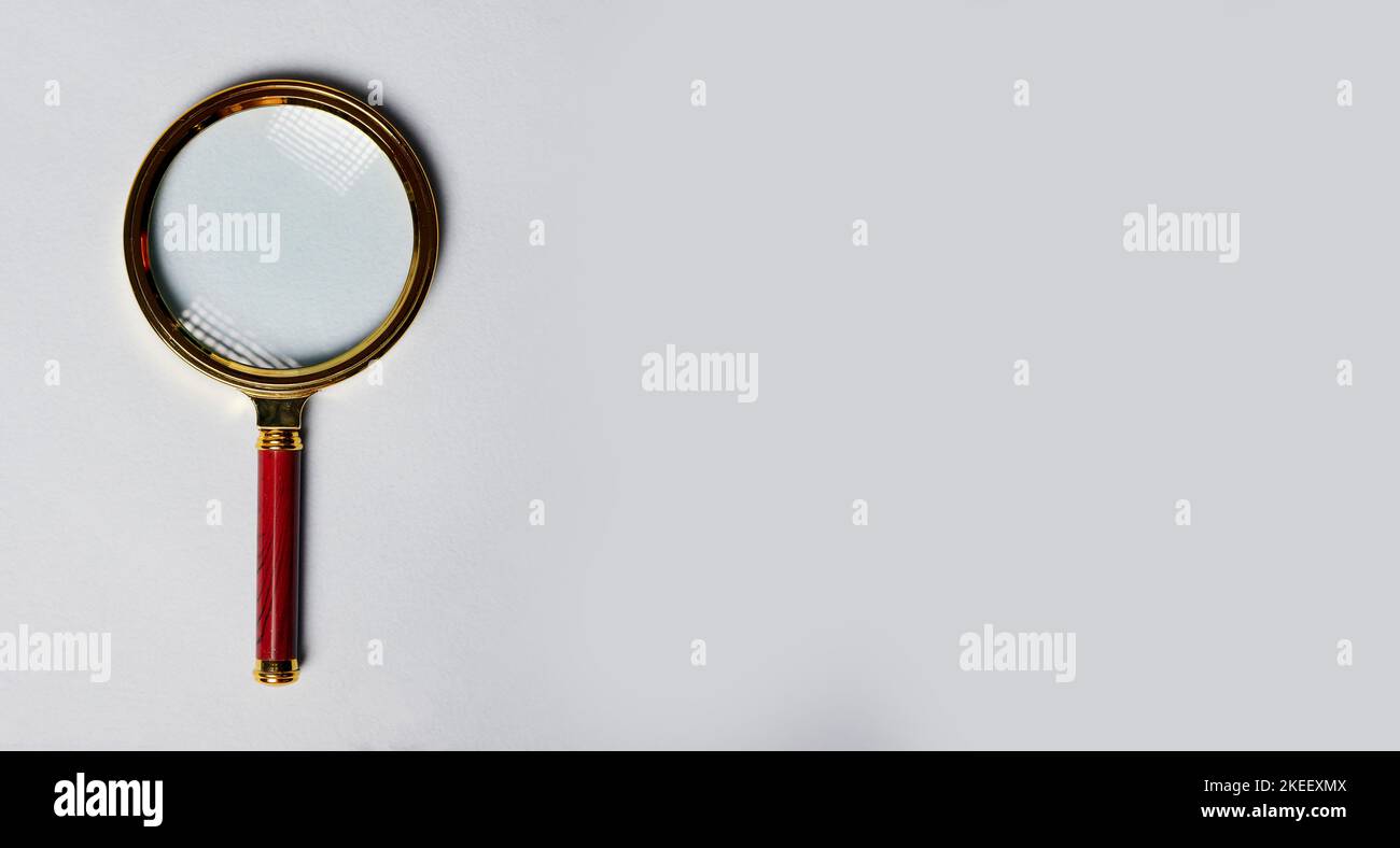 Magnifier on minimal blue gray background with copy space. Banner Stock ...