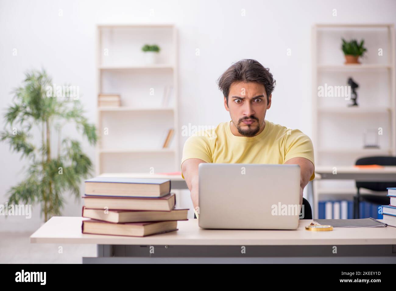 Young student in telestudying concept Stock Photo - Alamy